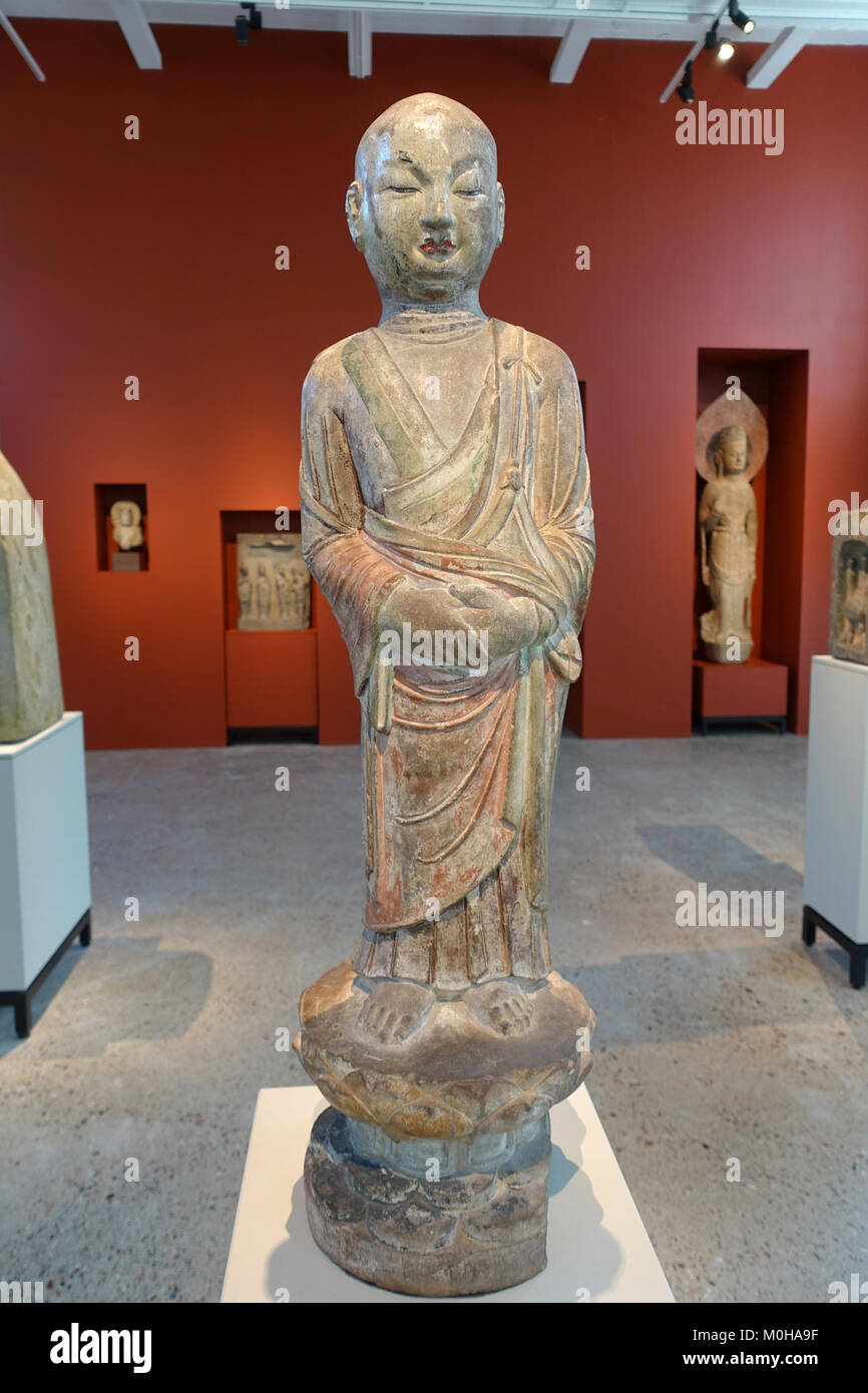 This sculpture depicts a Buddhist monk, likely Ananda, from the Tang ...