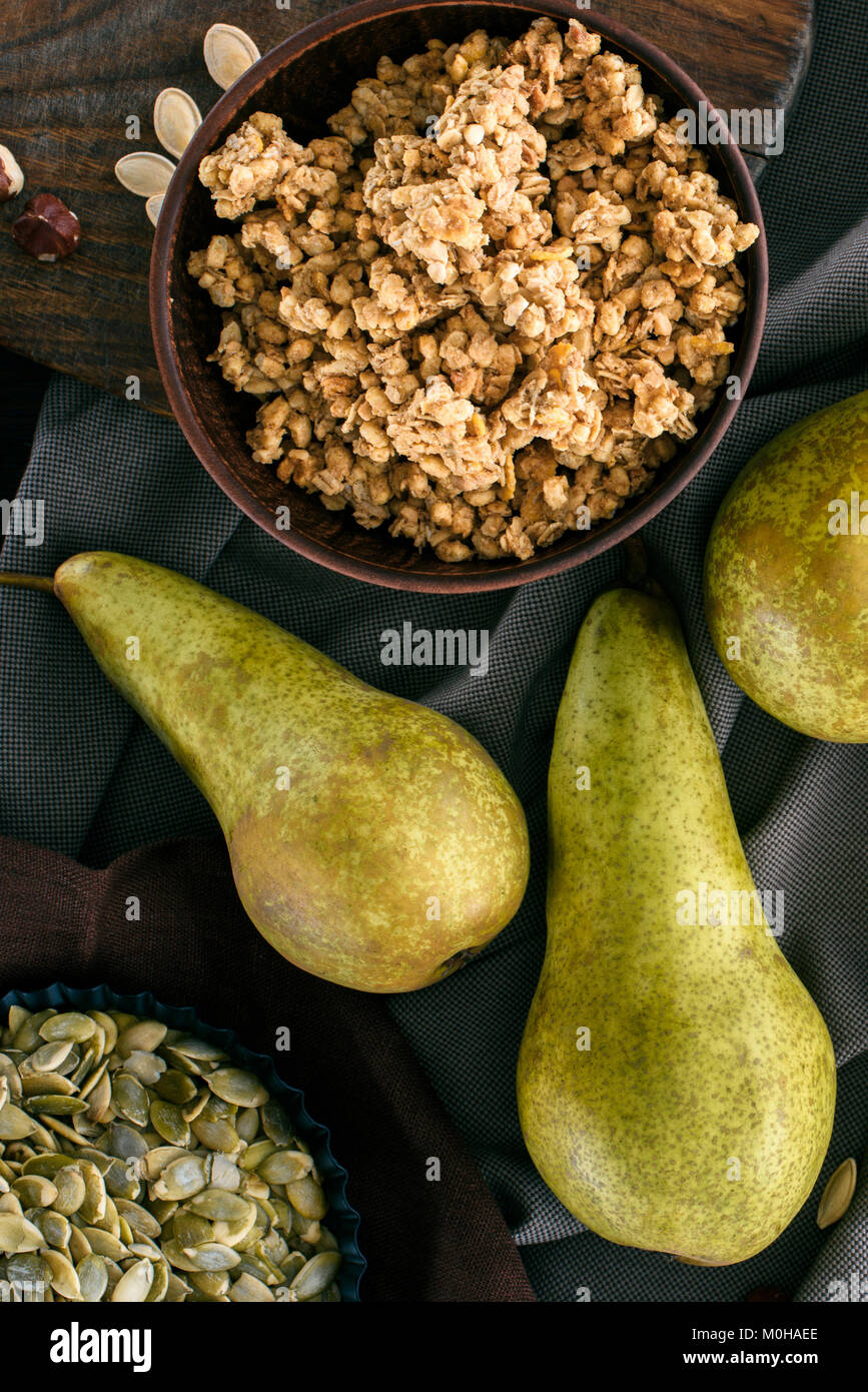 top view of crunchy granola and pears on table Stock Photo - Alamy
