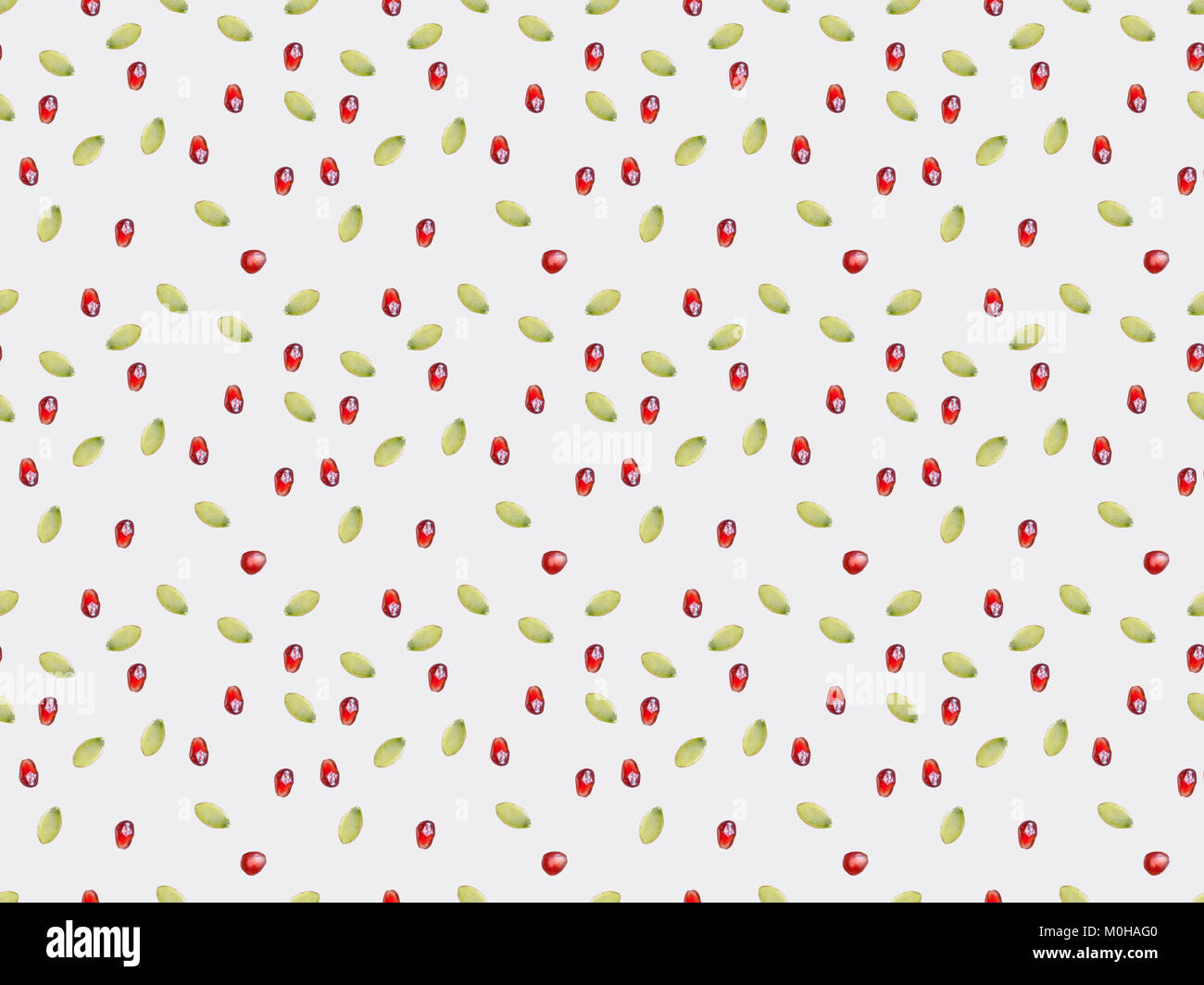 pattern of pomegranate and pumpkin seeds isolated on white Stock Photo ...