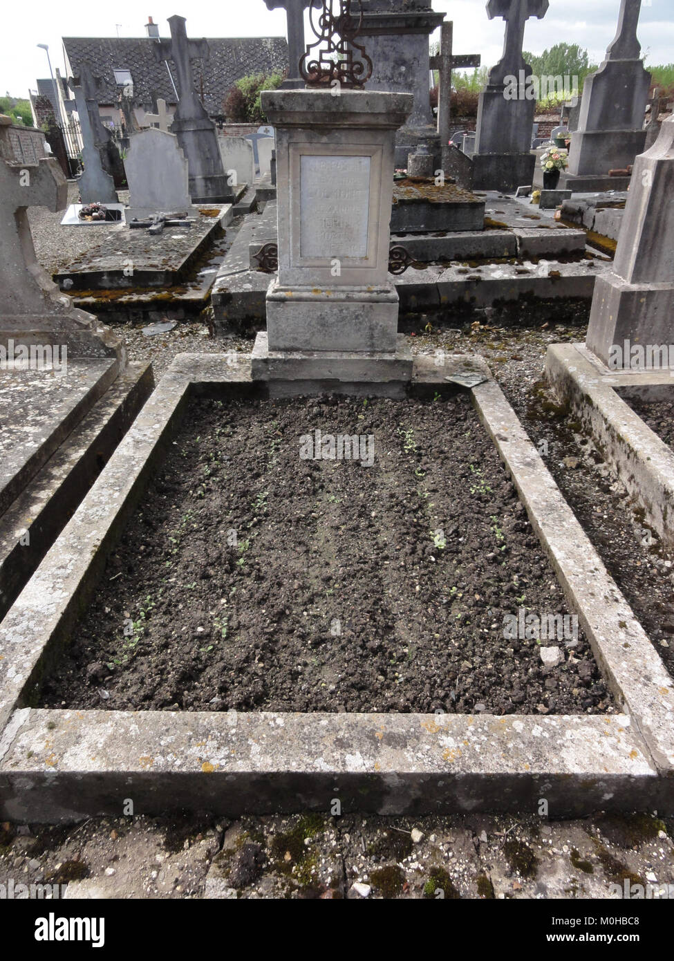 A photograph of the soldier’s grave at the Brissy-Hamégicourt cemetery in Aisne, France ...