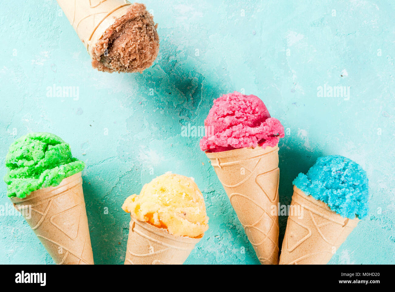 Selection of various bright multicolored ice-cream in ice cream cones ...