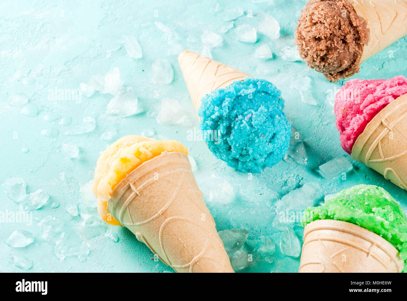 Selection of various bright multicolored ice-cream in ice cream cones ...