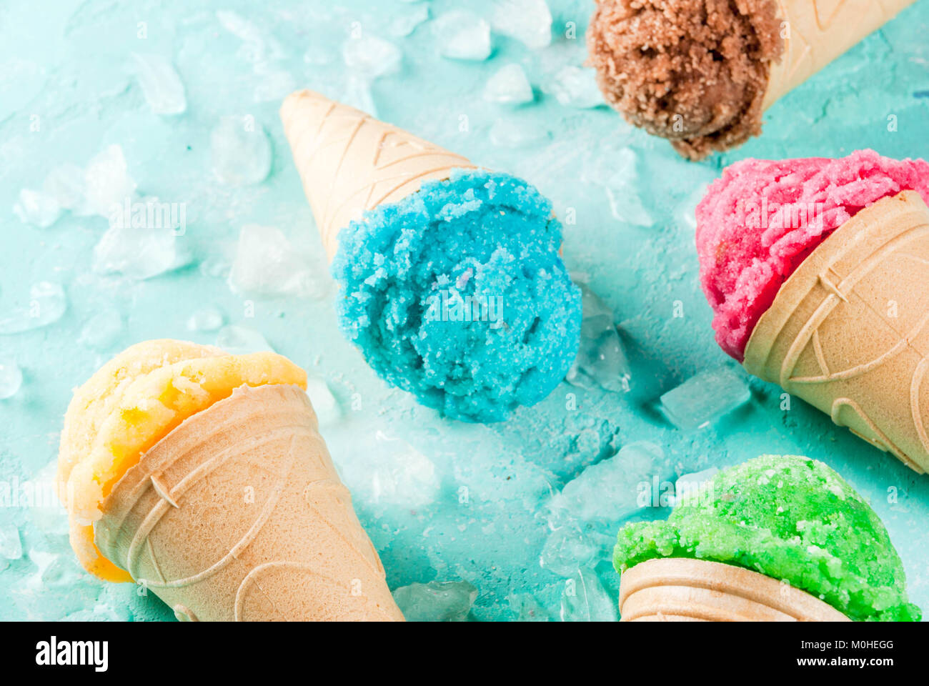 Selection of various bright multicolored ice-cream in ice cream cones ...