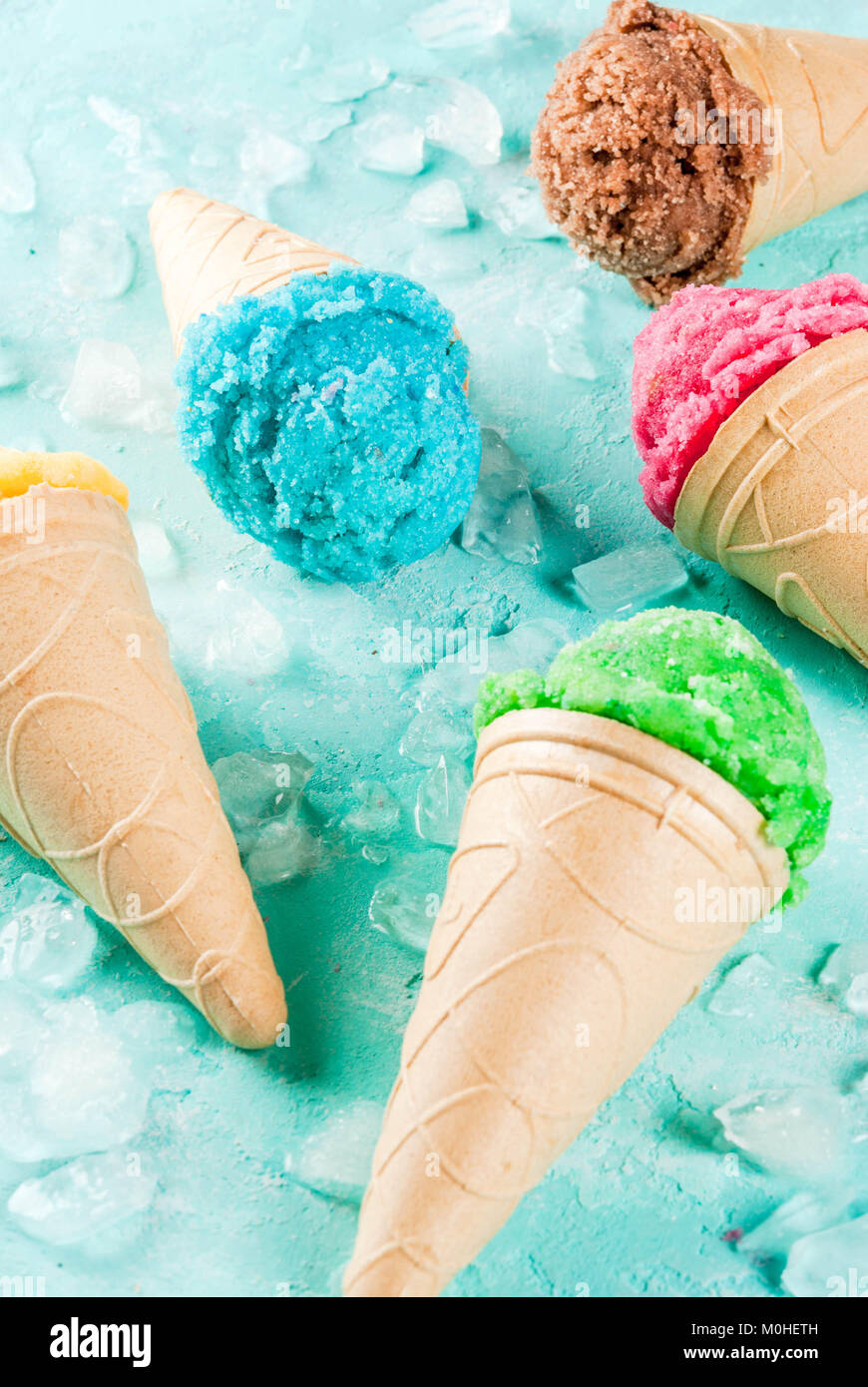 Selection of various bright multicolored ice-cream in ice cream cones ...