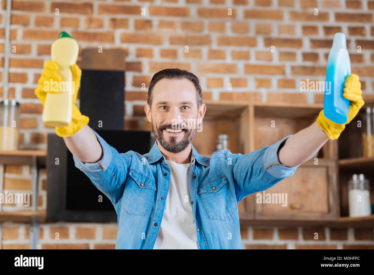 Active male cleaner cleaning the house Stock Photo - Alamy