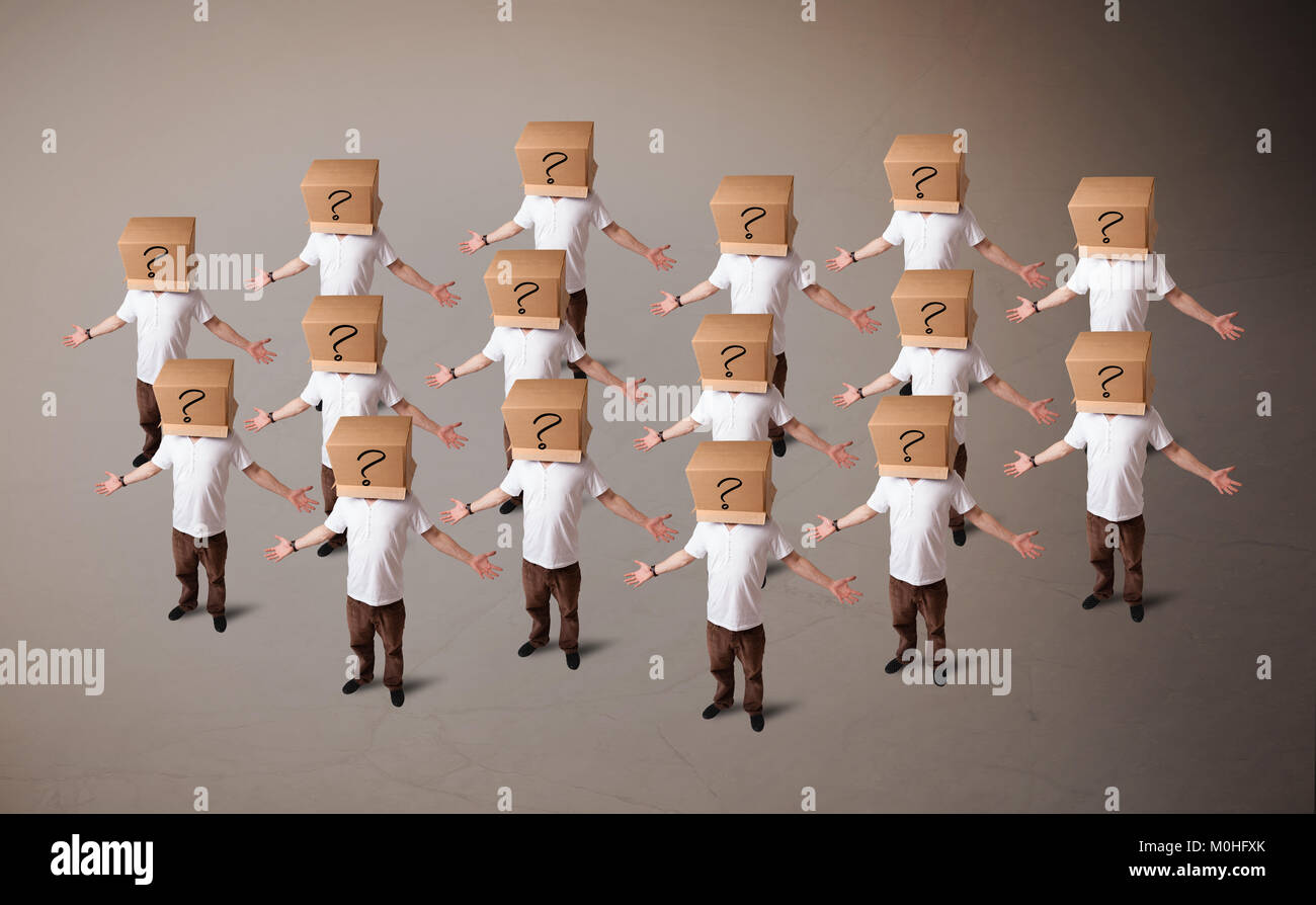 Group of handsome people gesturing with sketched question marks on box ...