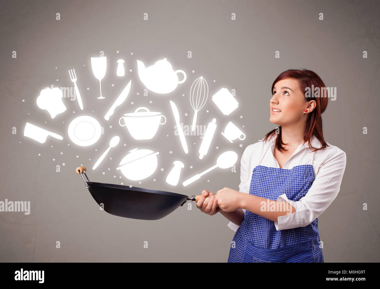Pretty young lady with kitchen accessories icons Stock Photo - Alamy