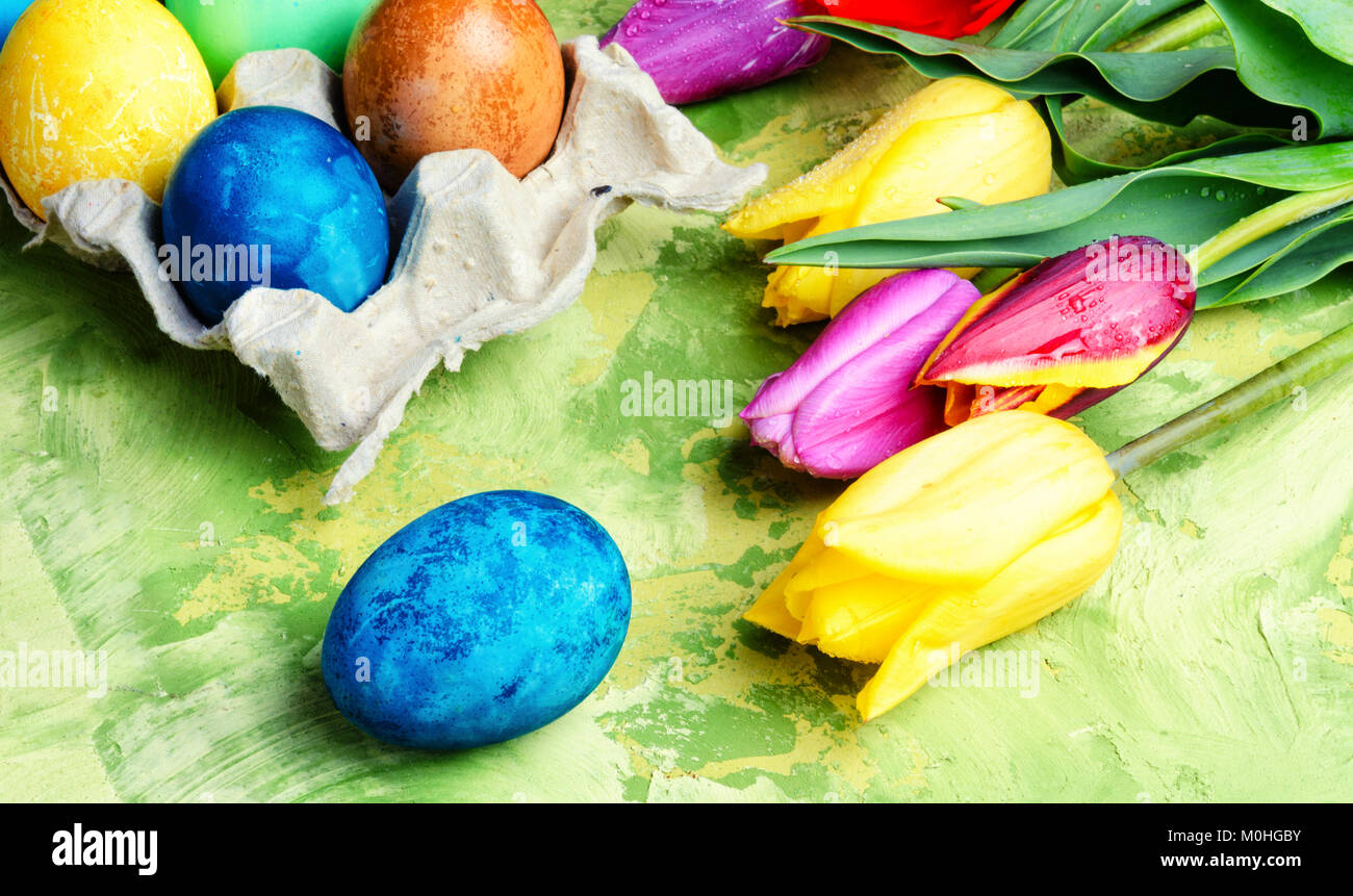 symbolic Easter colored egg and colorful paint Stock Photo - Alamy