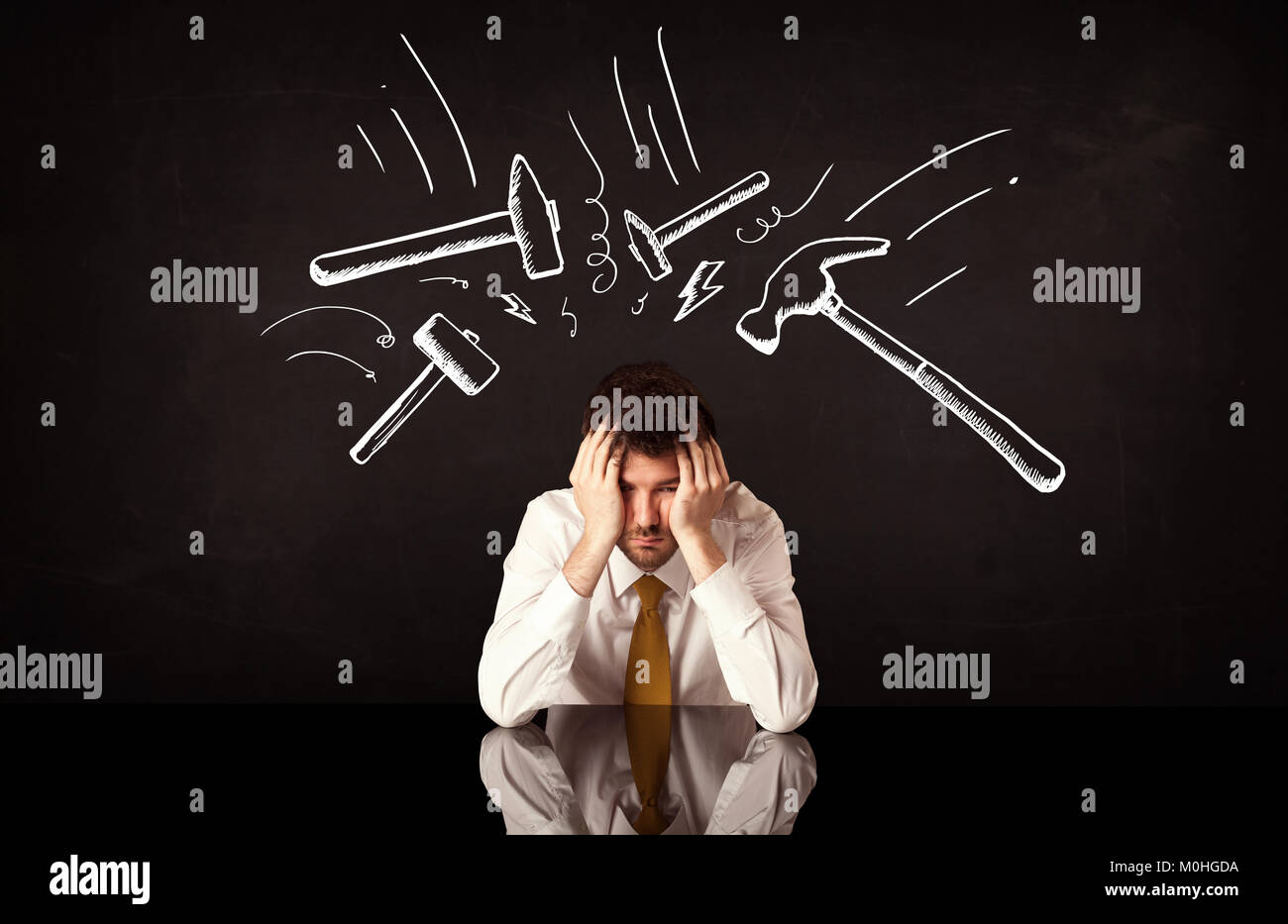 Young depressed businessman sitting under white drawn beating hammer ...