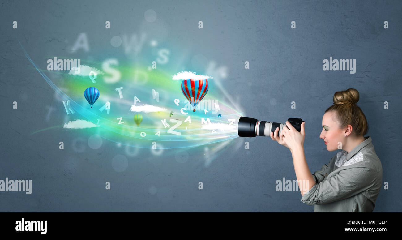 Cute photographer girl with camera and abstract imaginary Stock Photo ...