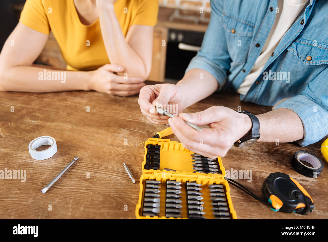 Strong male hands holding instrument Stock Photo - Alamy