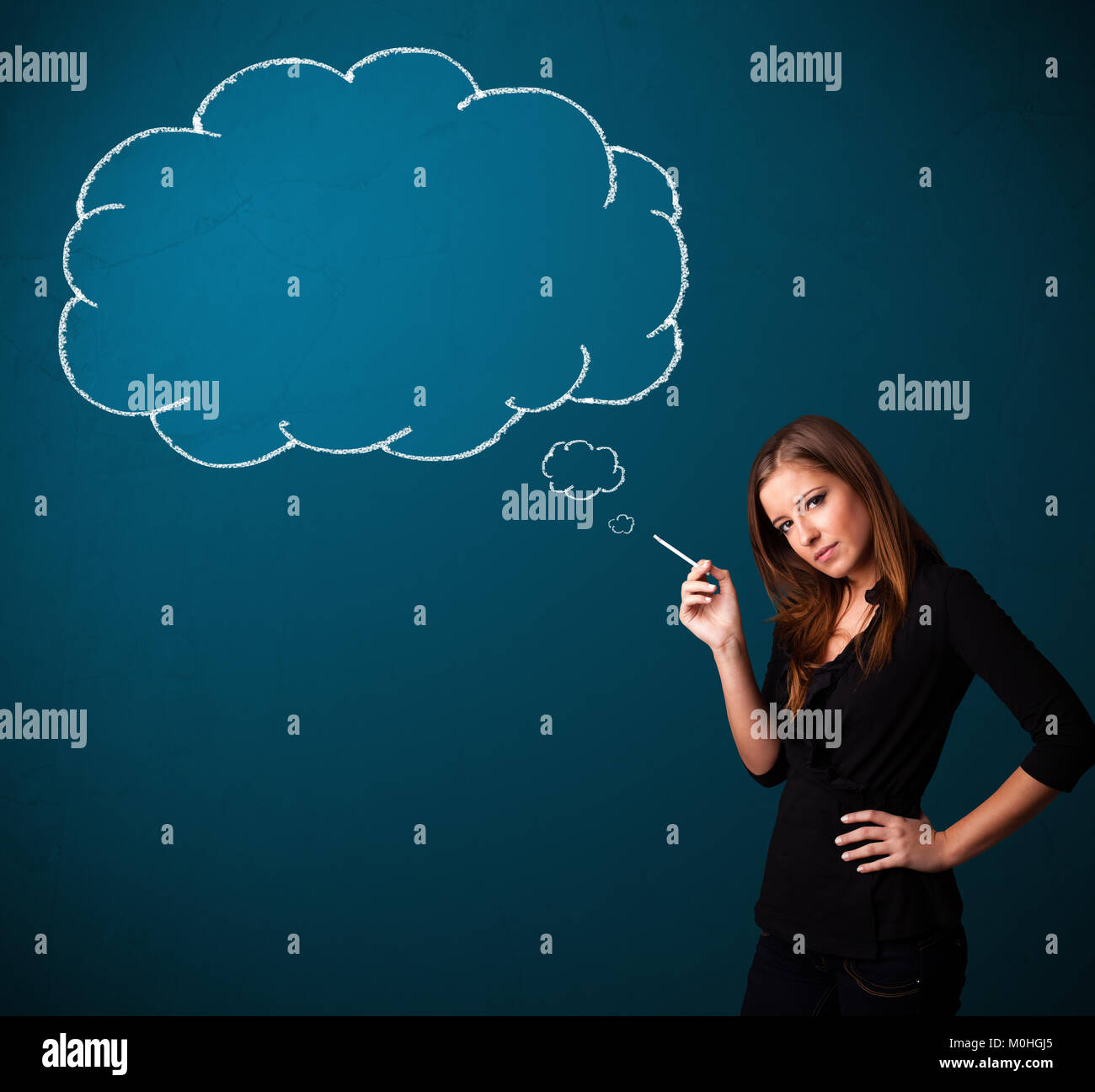 Beautiful young lady smoking cigarette with idea cloud Stock Photo - Alamy