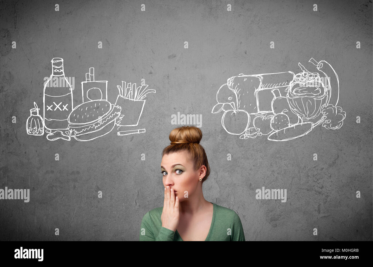 Woman choosing between foods hi-res stock photography and images - Alamy