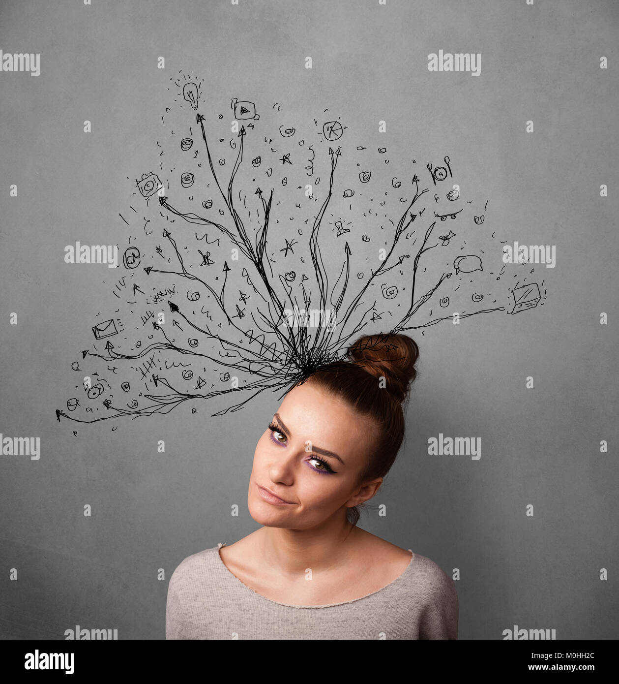 Pretty young woman thinking with tangled lines coming out of her head ...