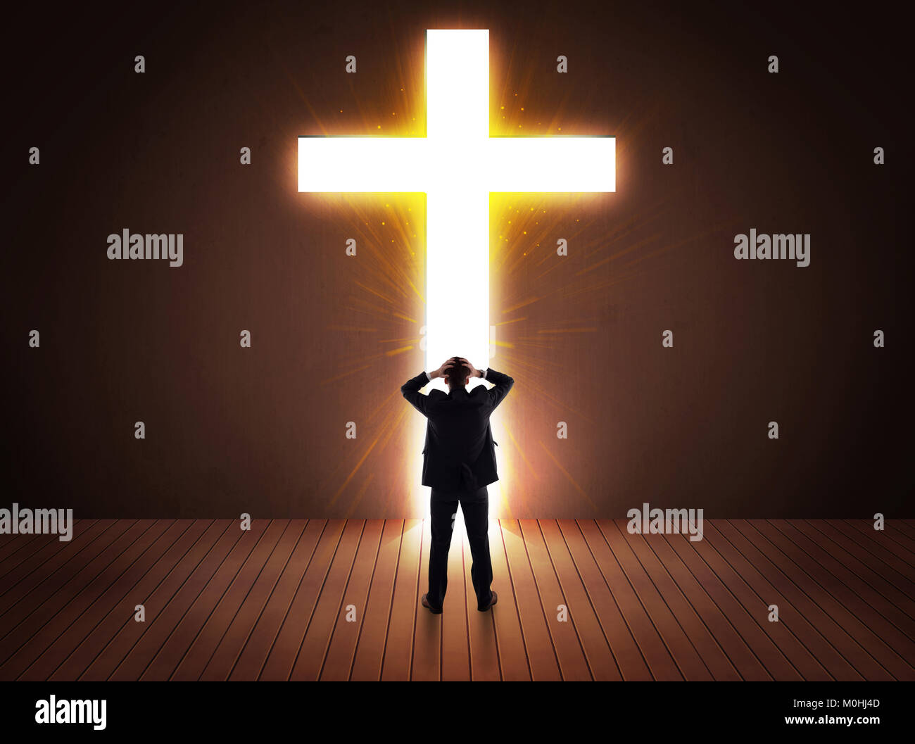 Man looking at bright cross sign concept Stock Photo - Alamy