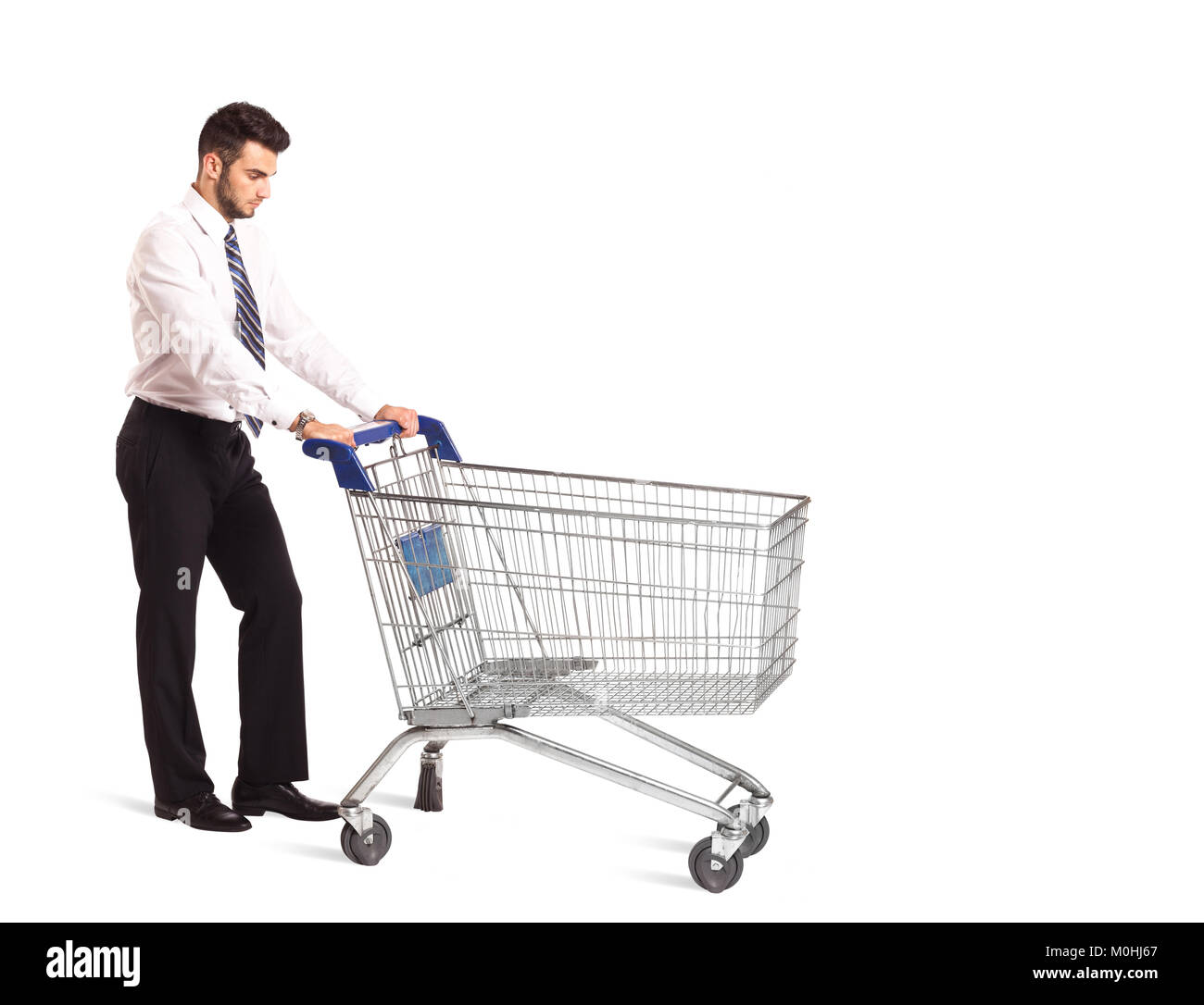 Businessman pushing a shopping cart on isolated background Stock Photo ...