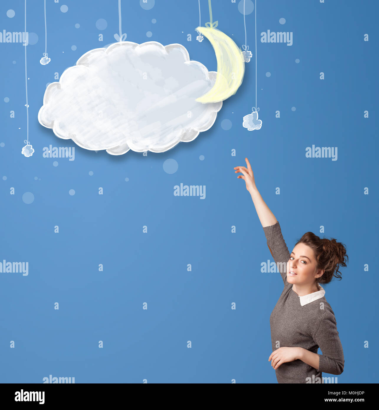 Young girl looking at cartoon night clouds with moon hanging down Stock ...