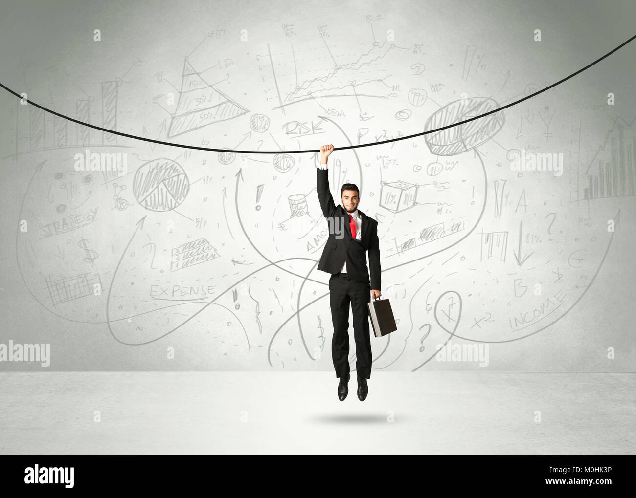 Businessman hanging on a rope with analysis and graphs background Stock ...