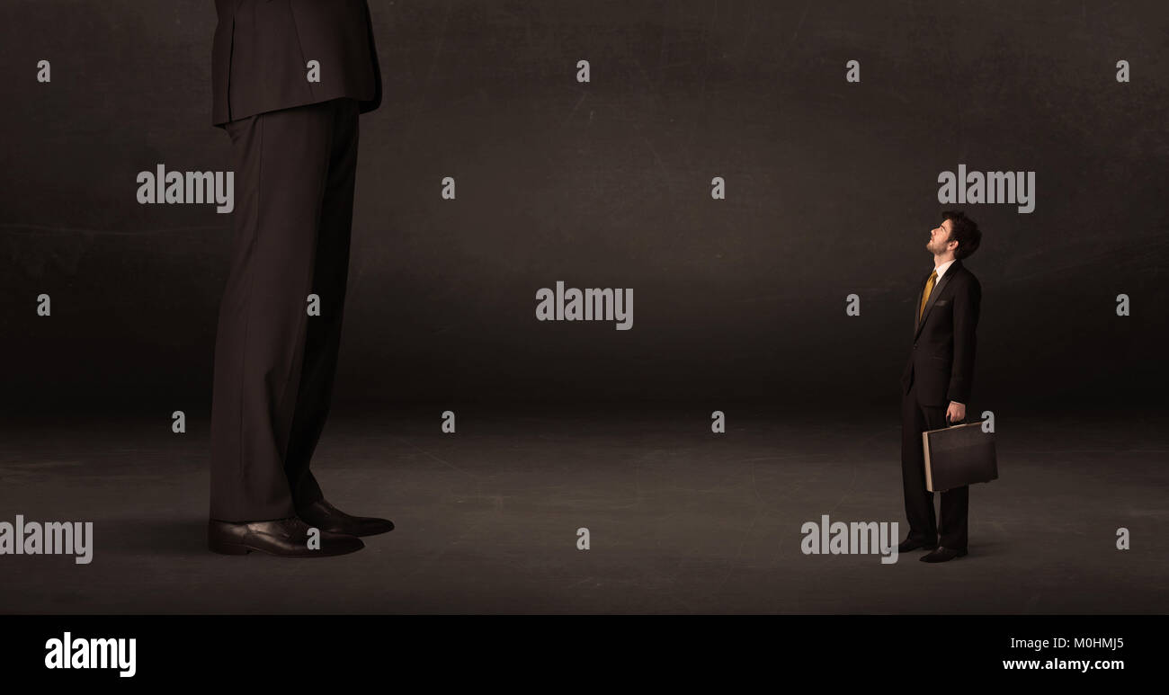 Giant man looking at small man hi-res stock photography and images - Alamy