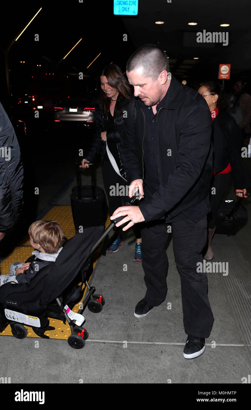Christian Bale at Los Angeles International Airport (LAX) with his son ...