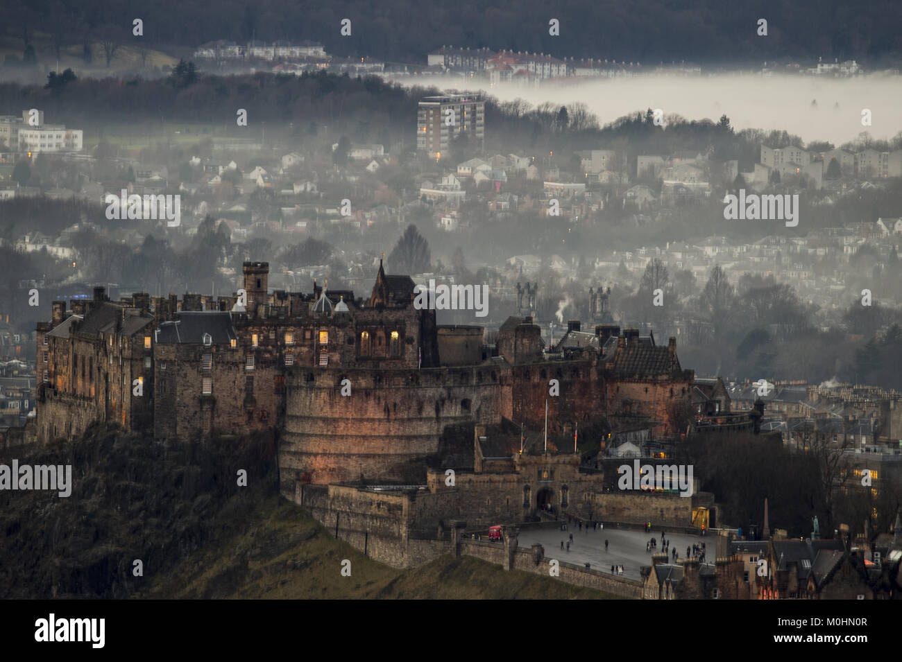 A thick mist rolls over Edinburgh city centre as shoppers crowd the ...