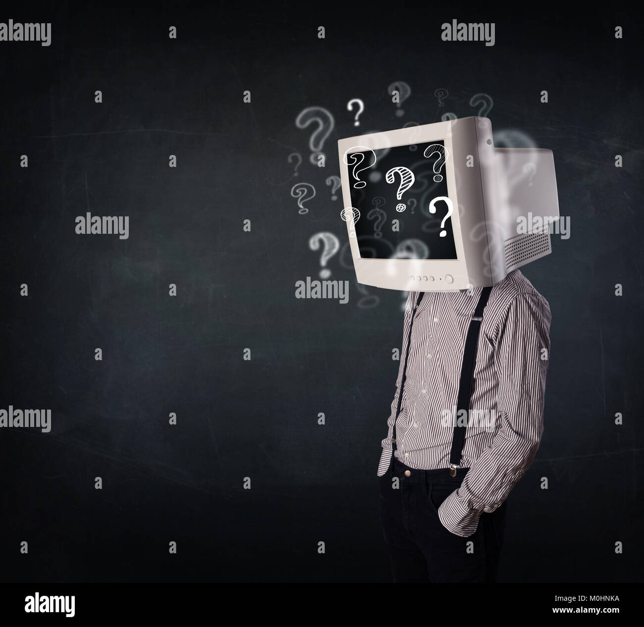 Businessman with a computer monitor head and question marks Stock Photo ...