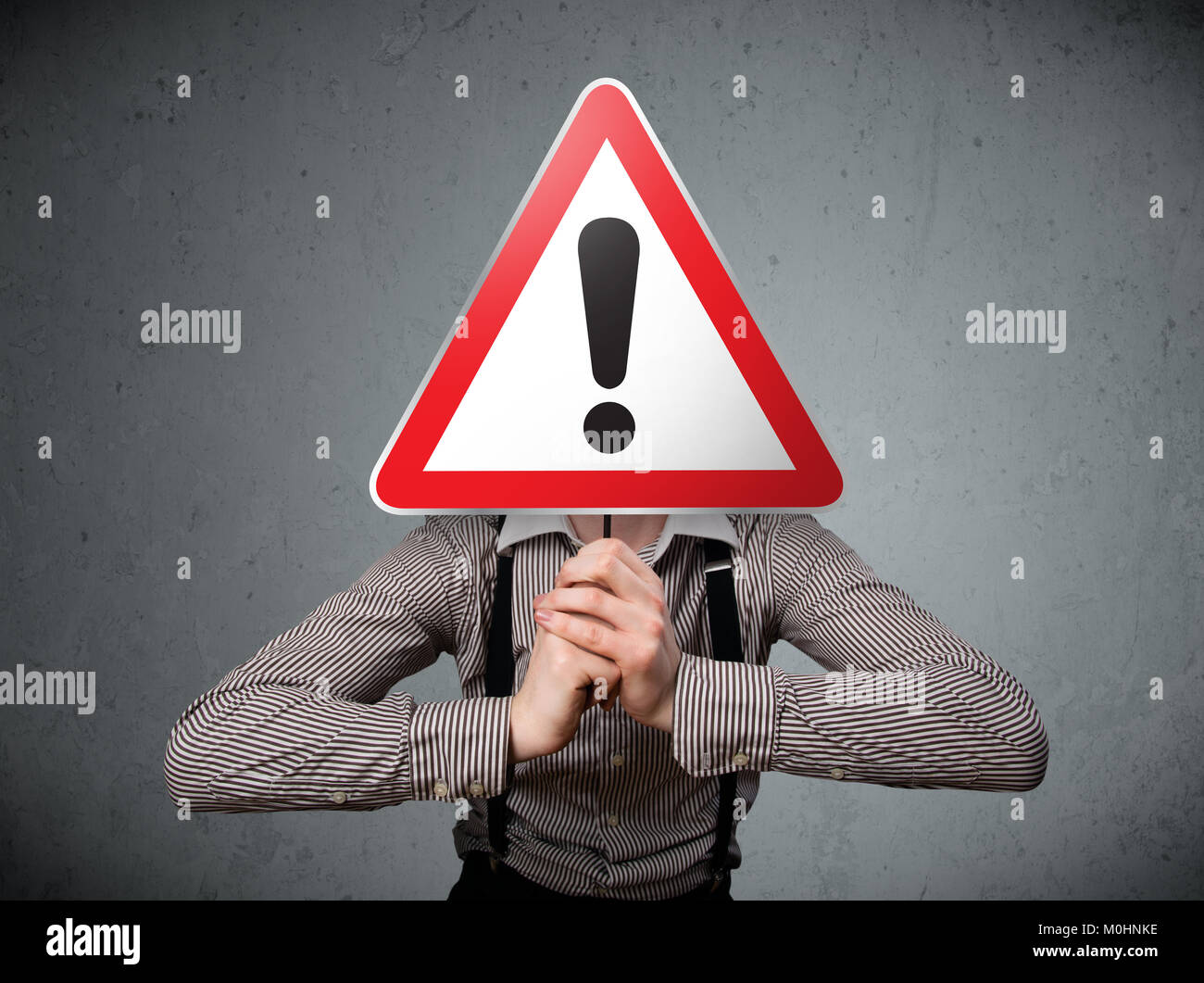 Business man hold a red exclamation mark hi-res stock photography and ...