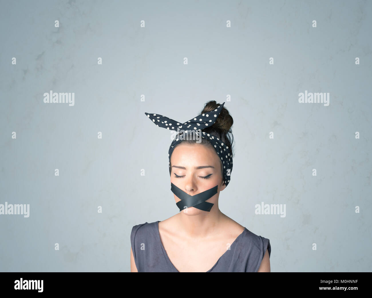 Mouth taped eyes closed hi-res stock photography and images - Alamy