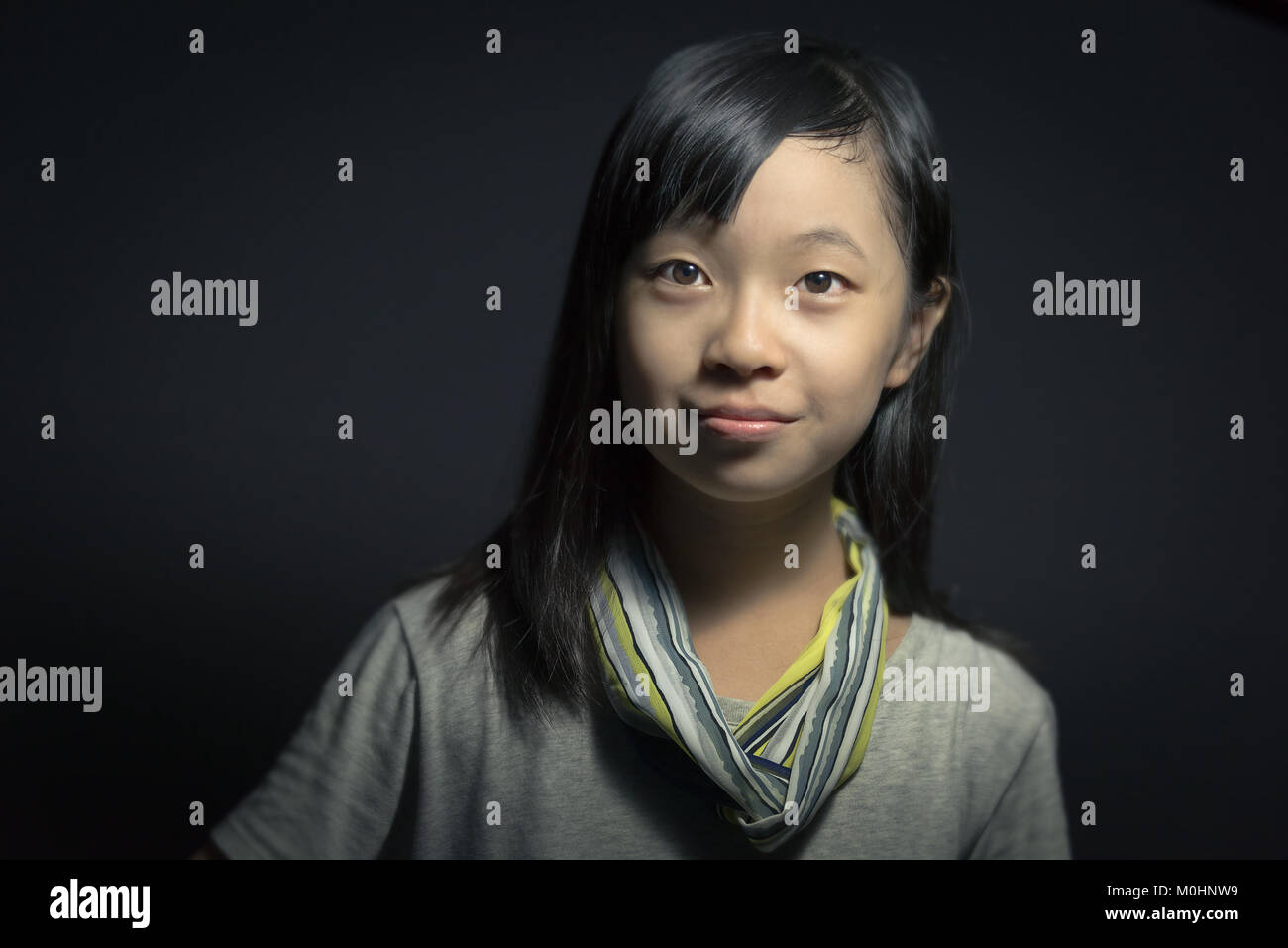 Girl smile portrait at studio light Stock Photo - Alamy