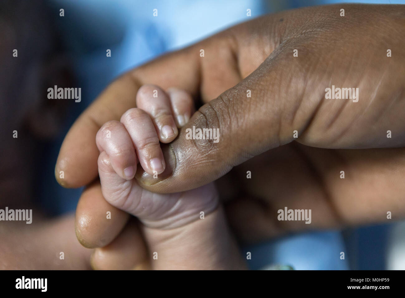 Indian baby hand hi-res stock photography and images - Alamy
