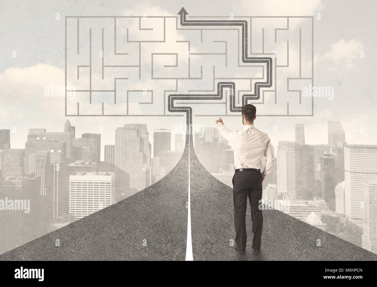 Businessman looking at road with maze and solution concept Stock Photo ...