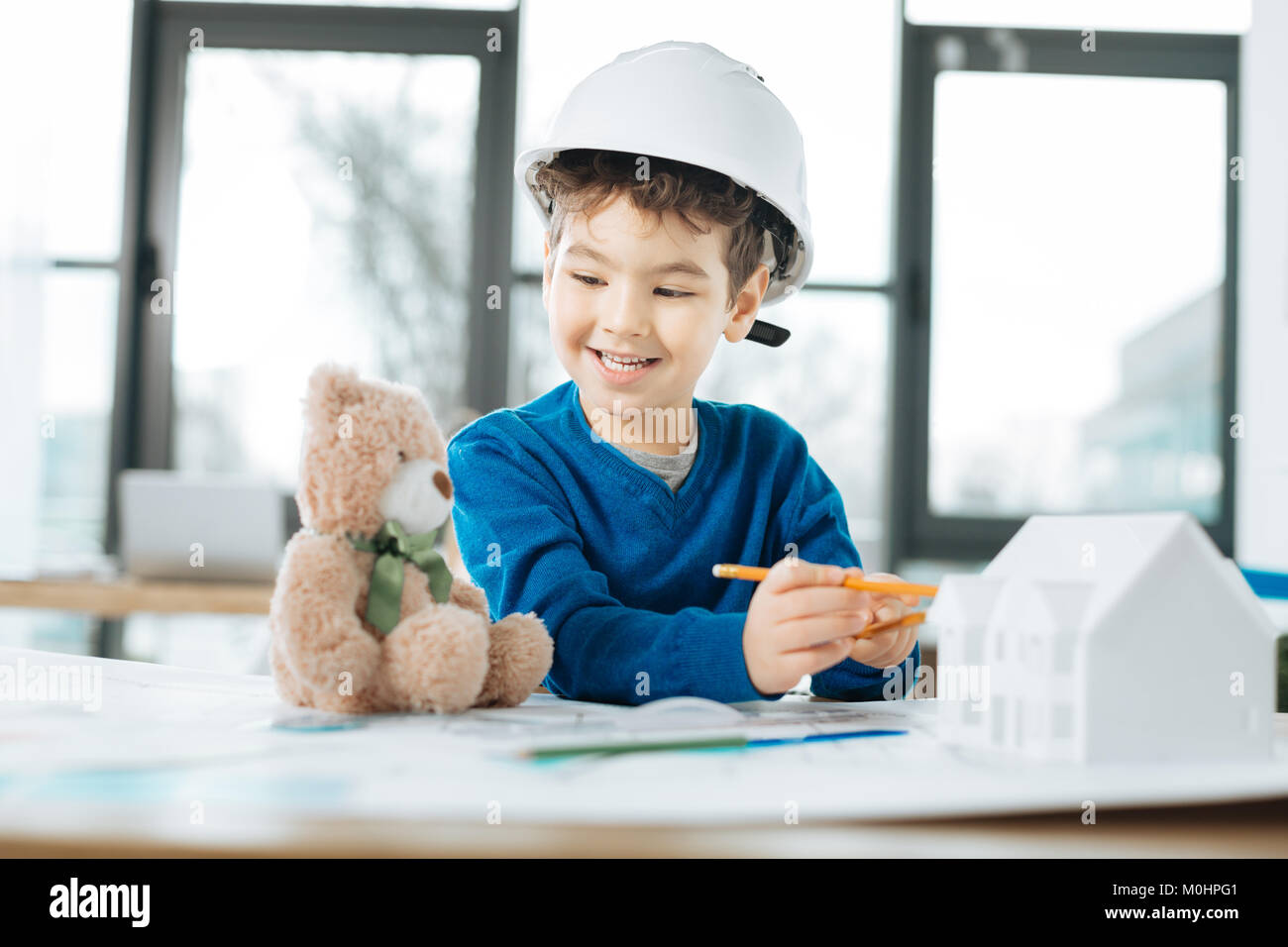 Little boy drawing a picture of his bear Stock Photo - Alamy