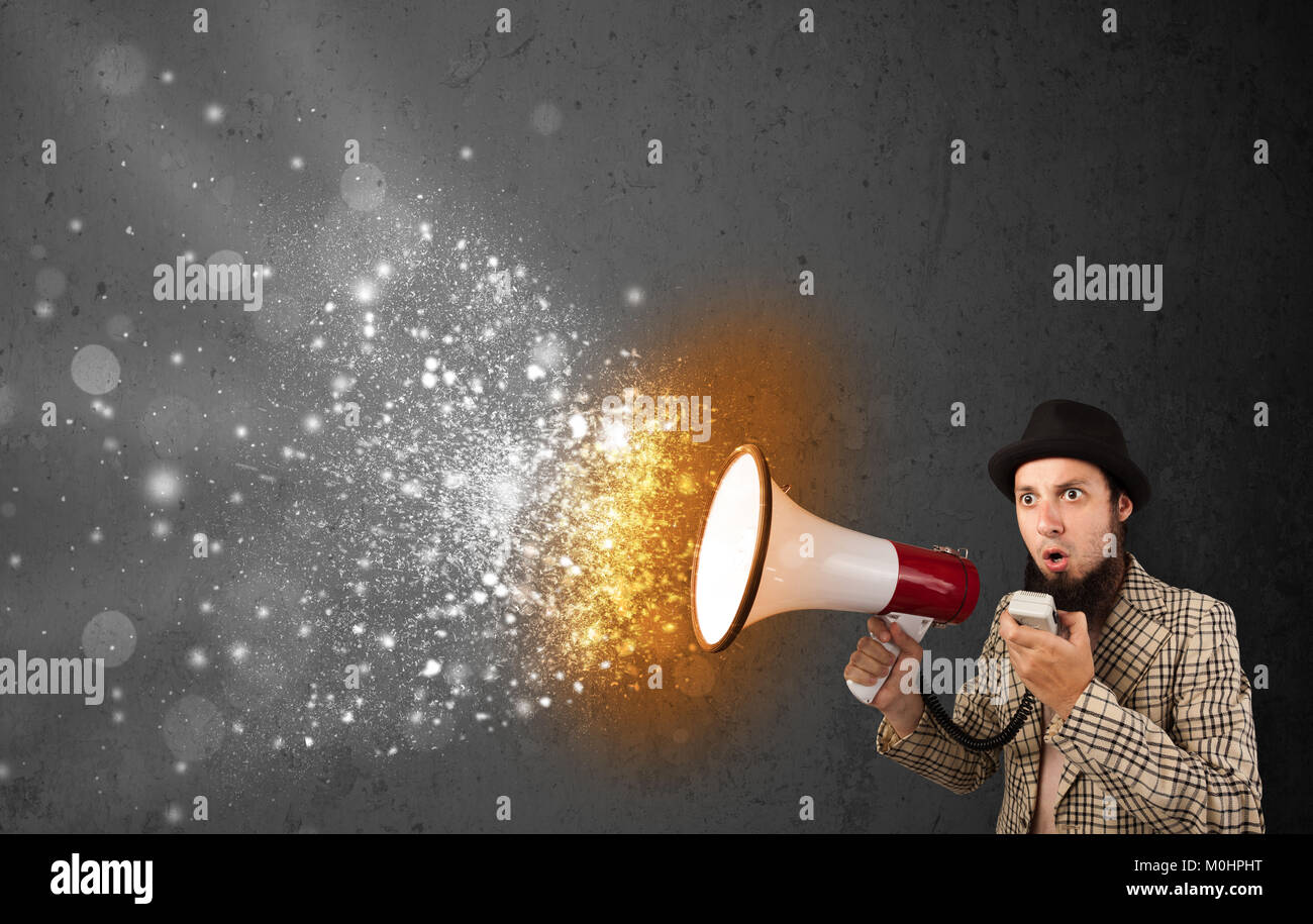 Guy shouting into megaphone and glowing energy particles explode ...