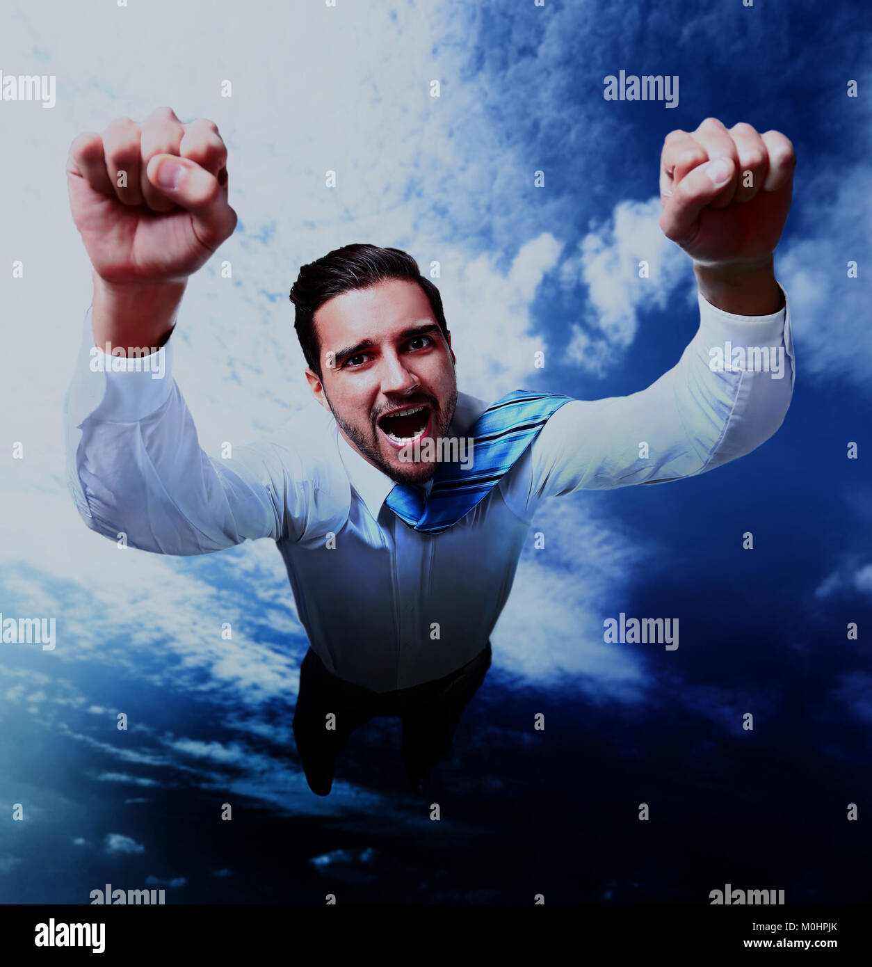 Happy businessman flying in the sky Stock Photo - Alamy