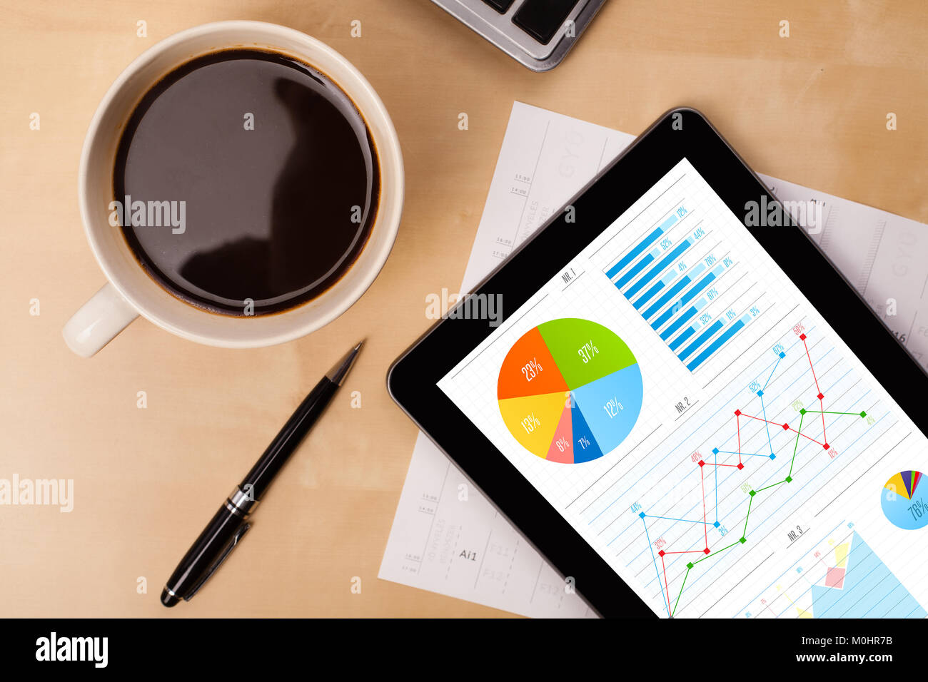 Digital tablet showing charts hi-res stock photography and images - Alamy