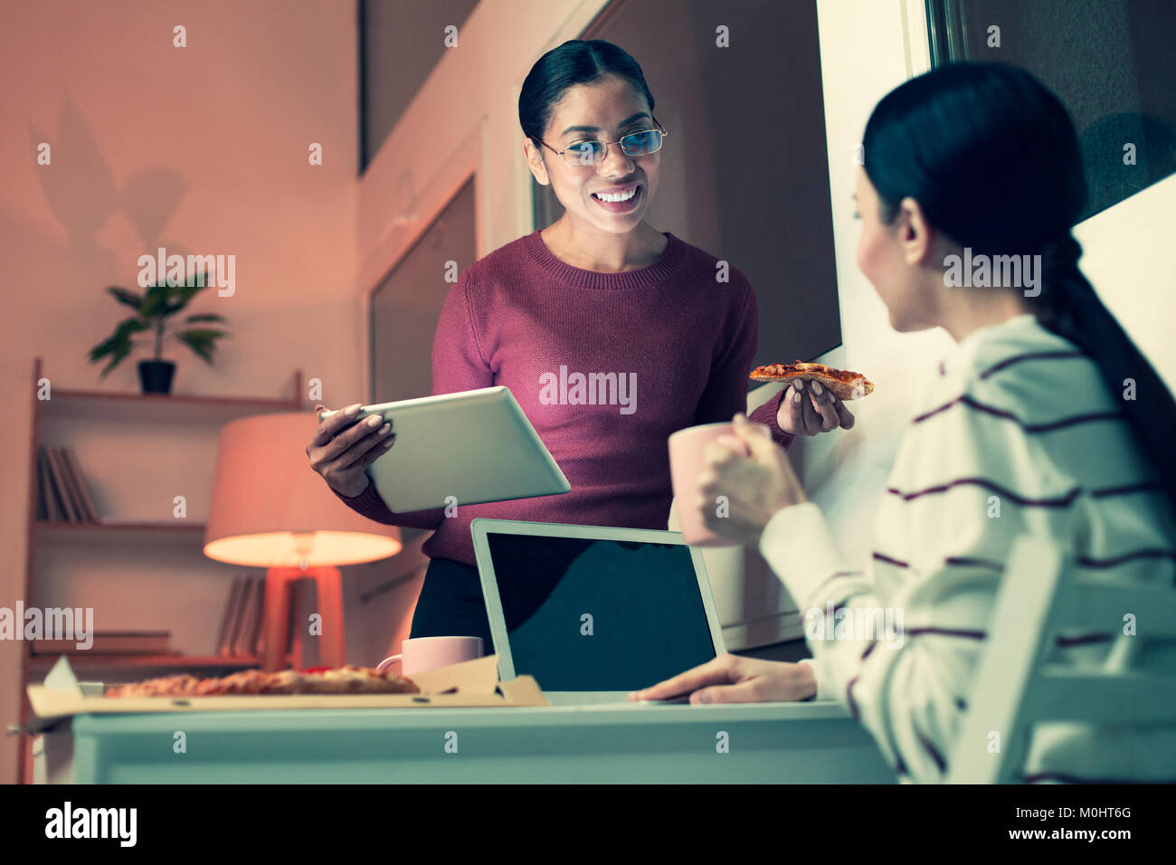 Cheerful women discussing project in non-formal ambience Stock Photo ...