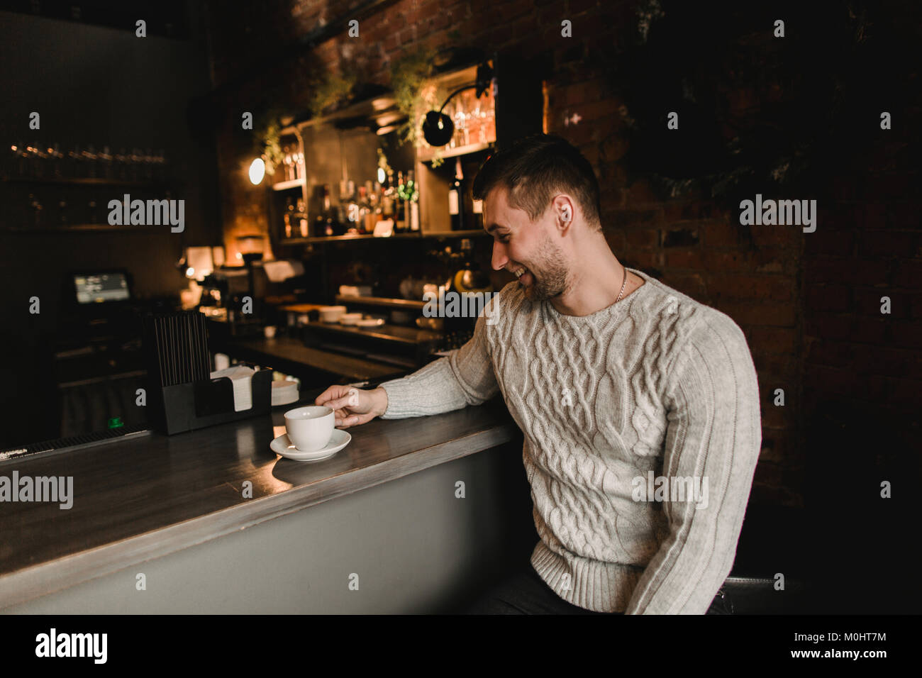Man in cafe with cup of coffe. Lifestyle portrait of handsome boy in ...