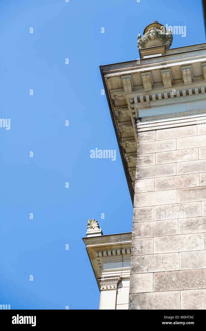 Wall and statues on roof of old German castle in blue sky Stock Photo ...
