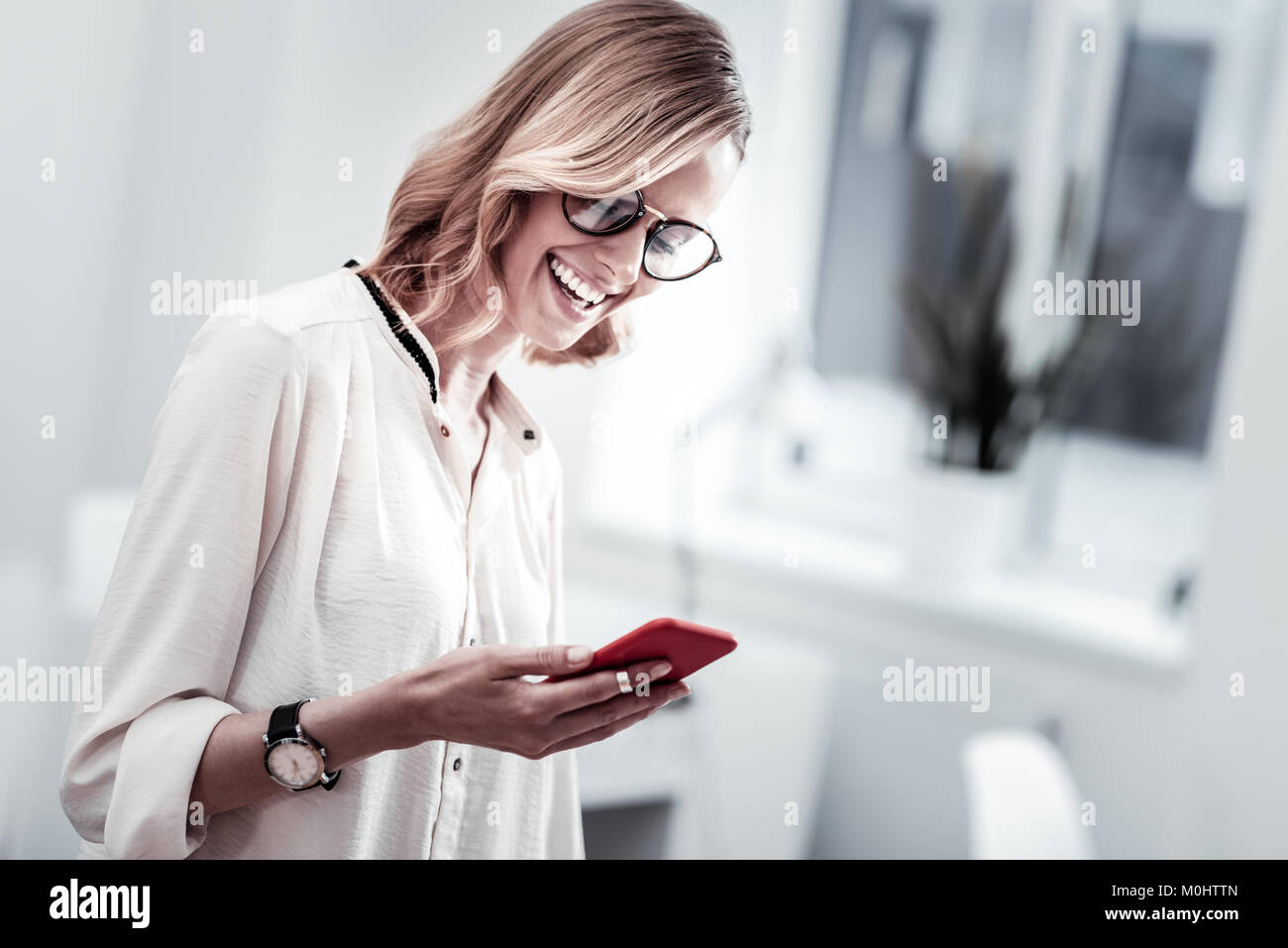 Pretty girl reading her incoming messages Stock Photo - Alamy