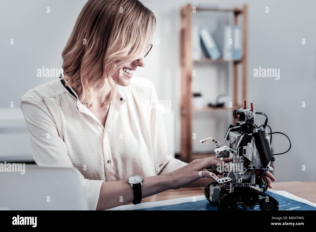 Charming woman testing her invention Stock Photo - Alamy