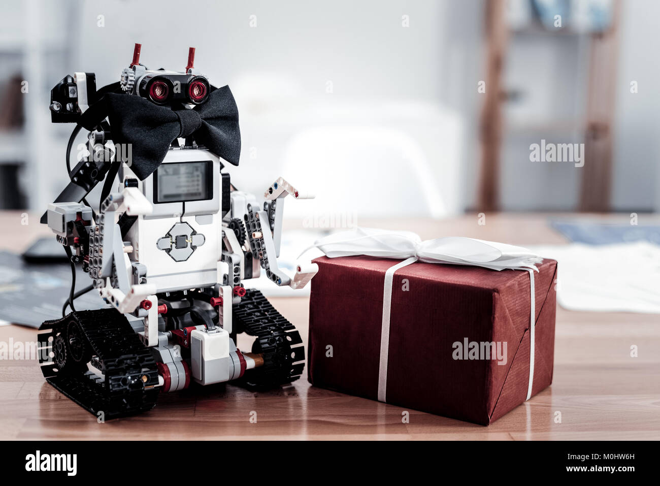 Modern robot standing on the table Stock Photo - Alamy