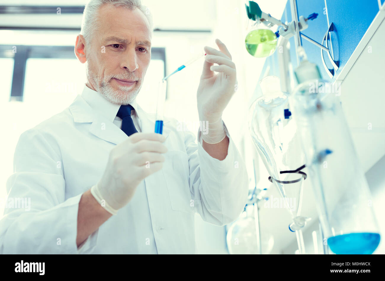 Cheerful lab worker working on chemical researcher Stock Photo - Alamy