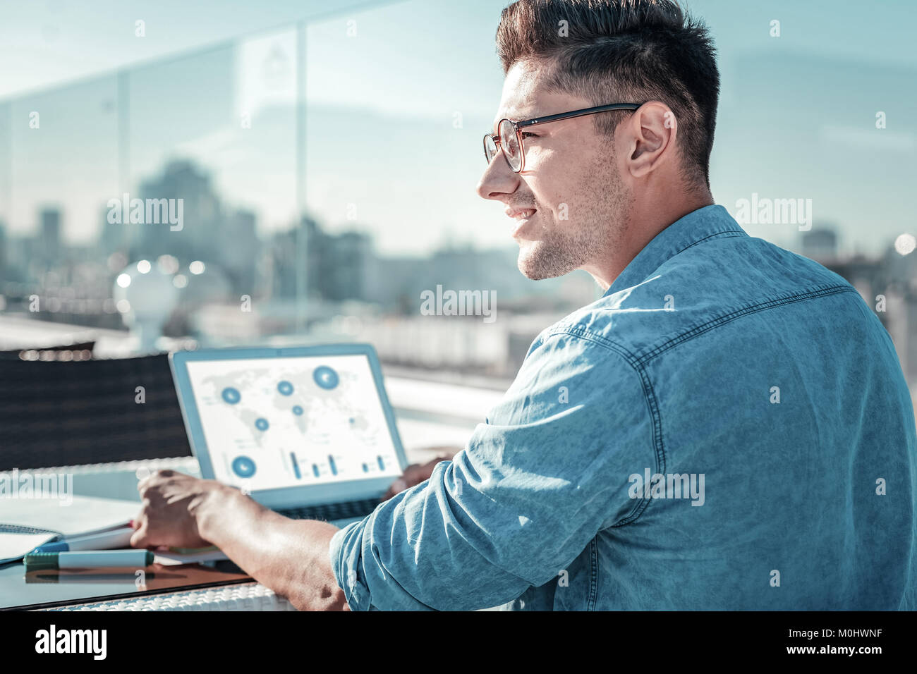 Pensive young entrepreneur generating new business ideas Stock Photo ...