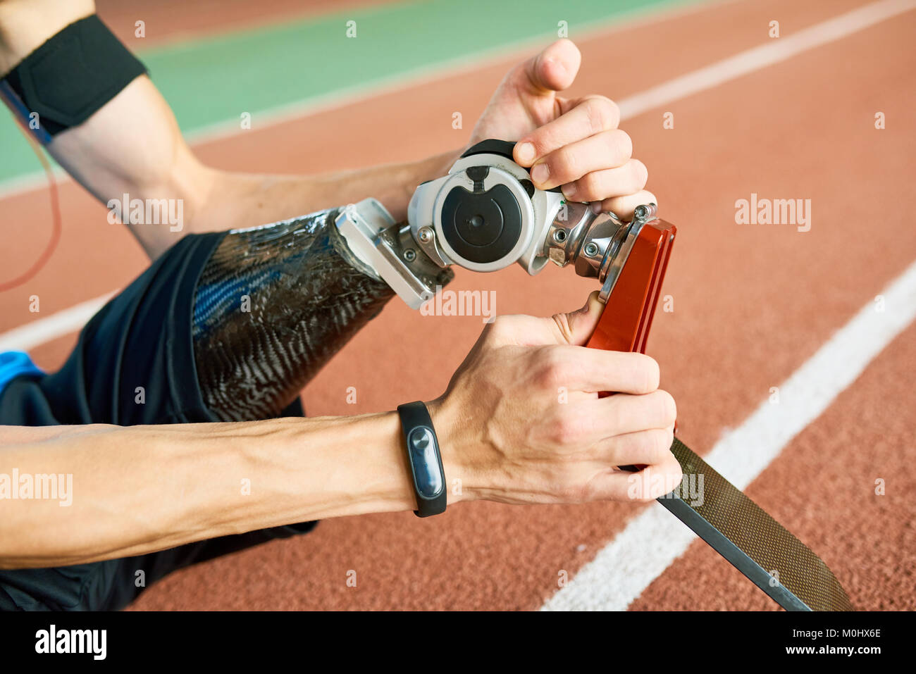 Disabled Sportsman Fixing Artificial Limb Stock Photo - Alamy