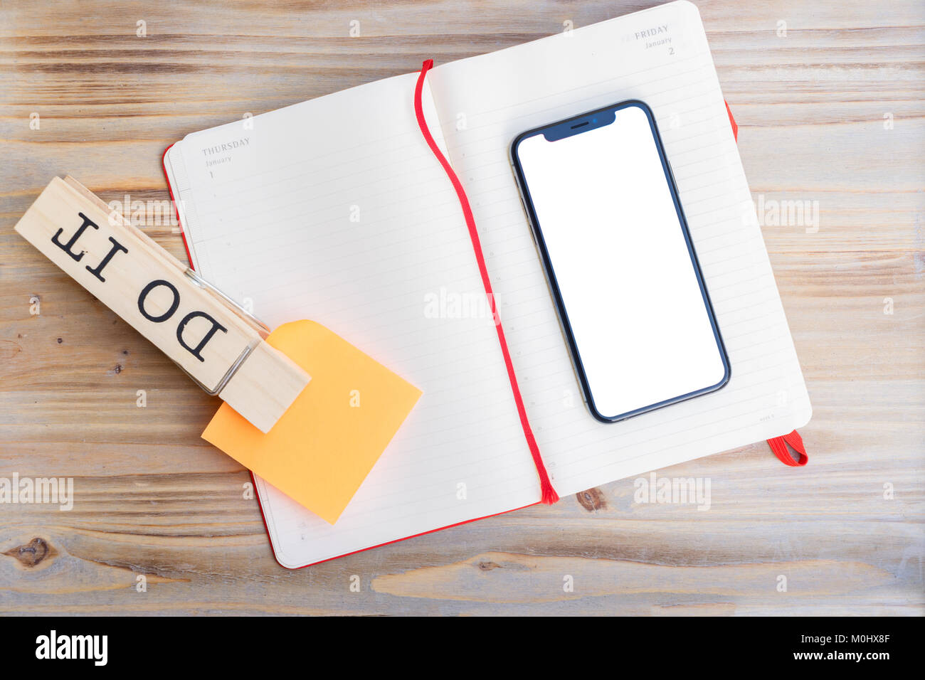 Notebook with phone Stock Photo - Alamy