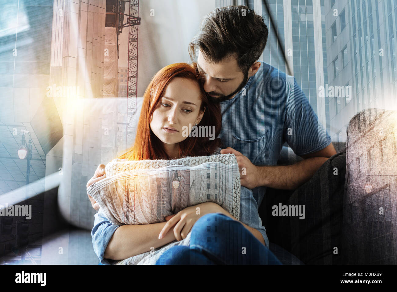 Romantic Man Hugging His Girlfriend While Asking For Forgiveness Stock