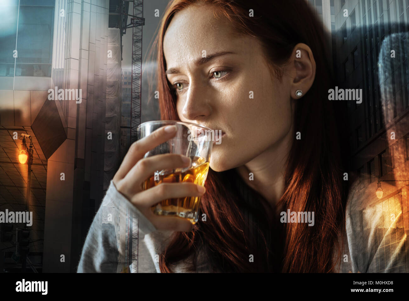 Depressed woman feeling awful and drinking alcohol Stock Photo - Alamy