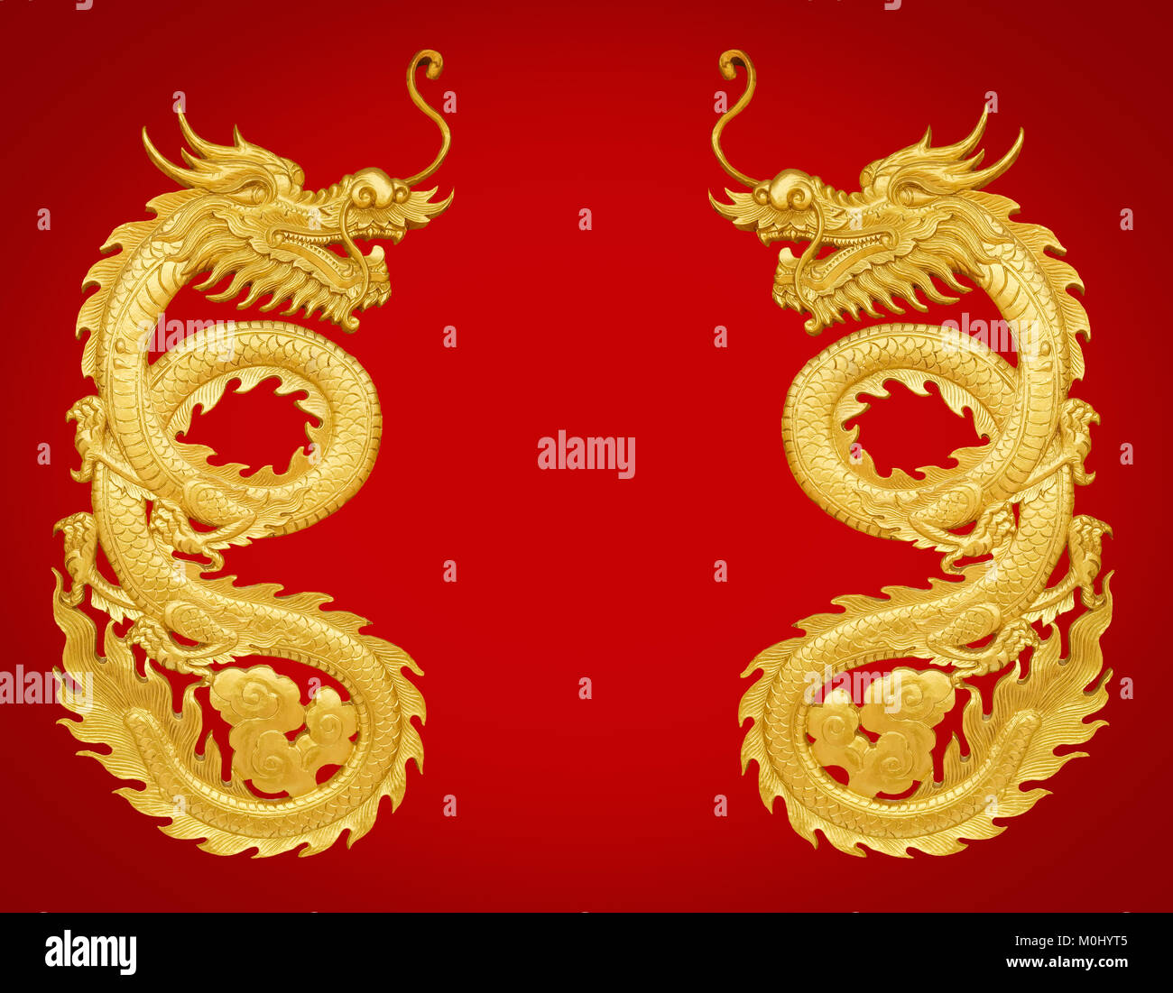 Close up golden wooden craft dragon isolated on red background Stock ...