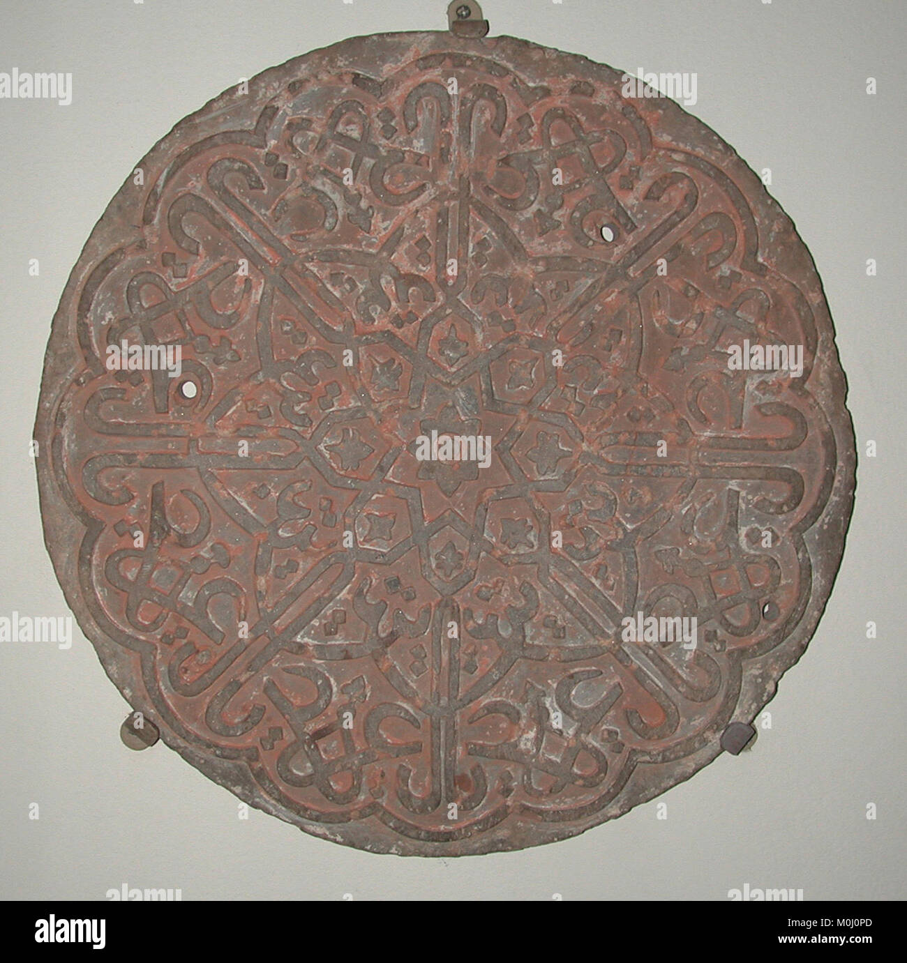 A circular calligraphic roundel inscribed with the Arabic phrase 'Ya ...