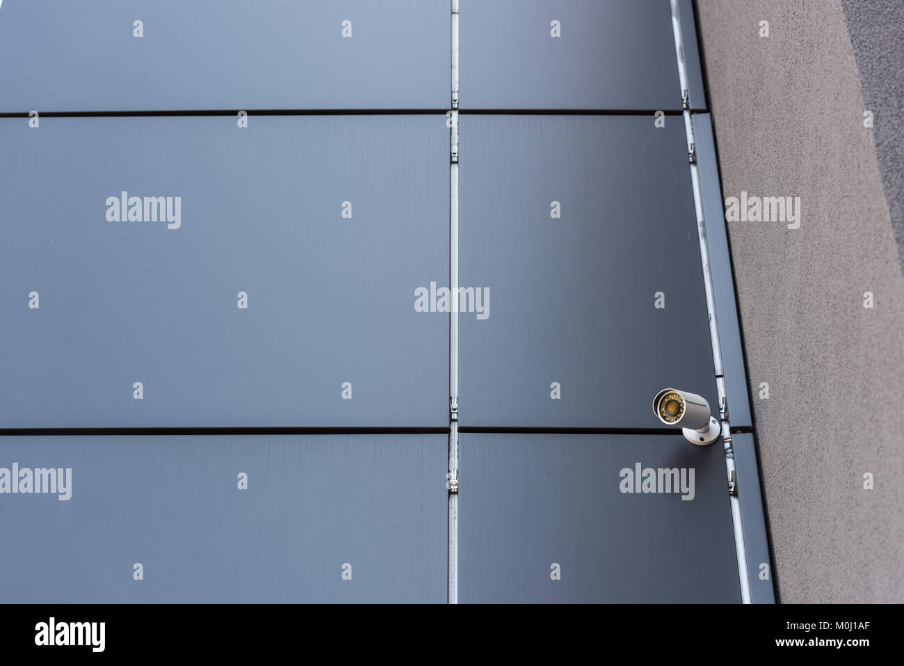 security camera on wall of office building, security system concept ...